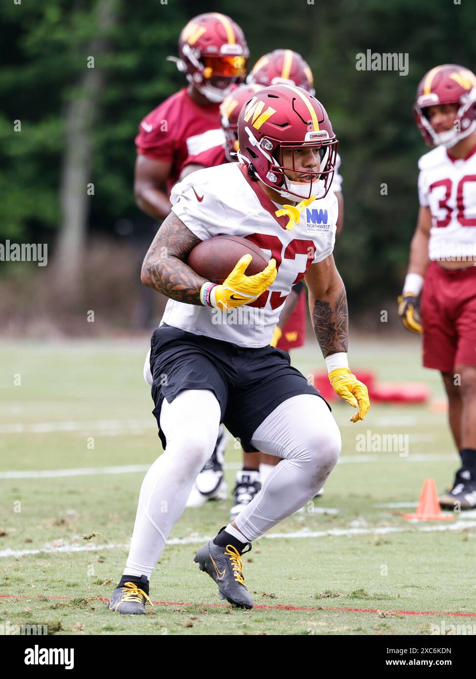Washington Commanders running back Chris Rodriguez (23) performing drills at mini camp at the ...