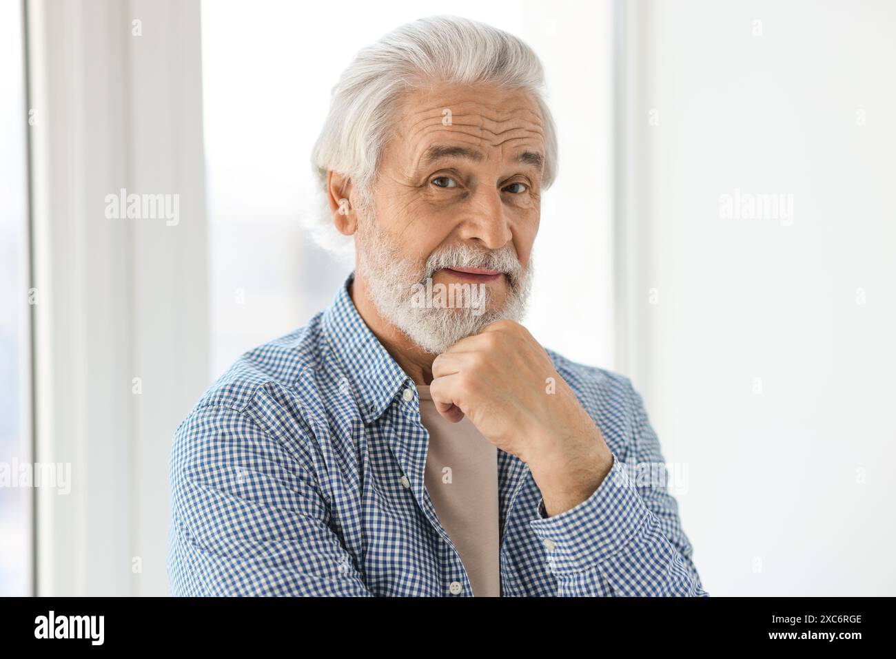 Portrait of happy grandpa with grey hair near window indoors Stock ...