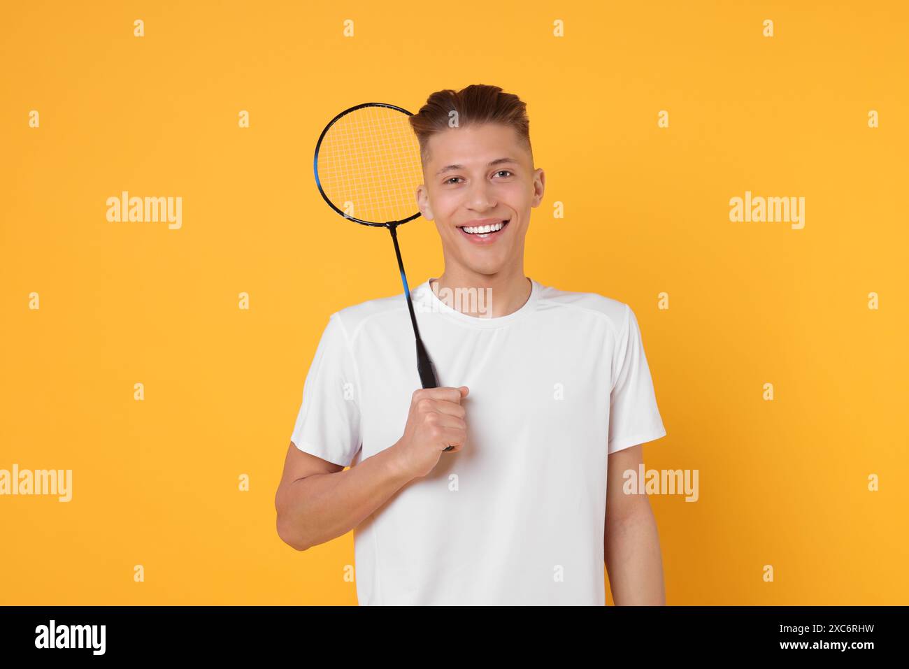 Man with badminton racket hi-res stock photography and images - Alamy