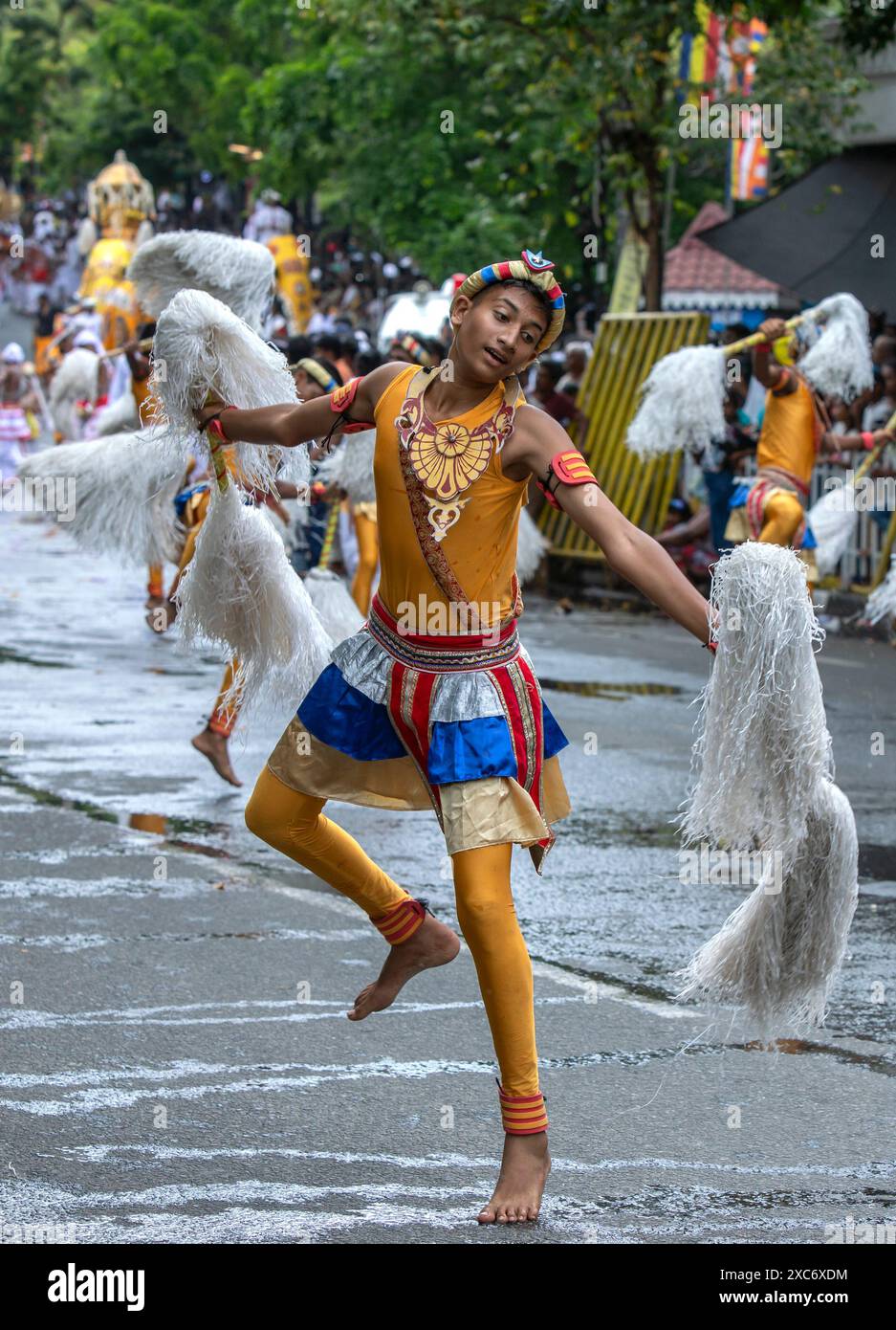 A Chamara Dancer performs along a street at Kandy in Sri Lanka during ...