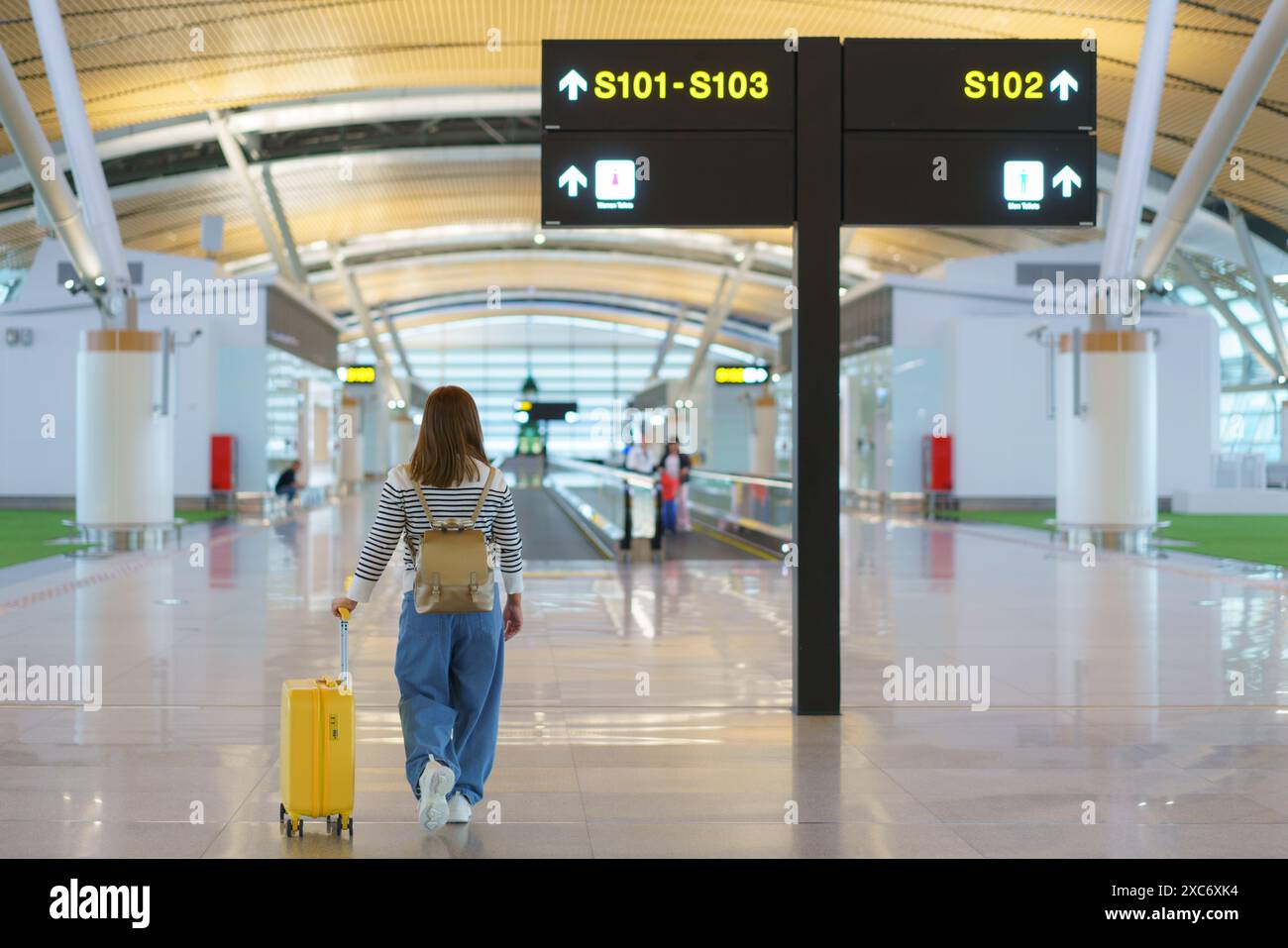 Asian woman walking rear view hi-res stock photography and images - Alamy
