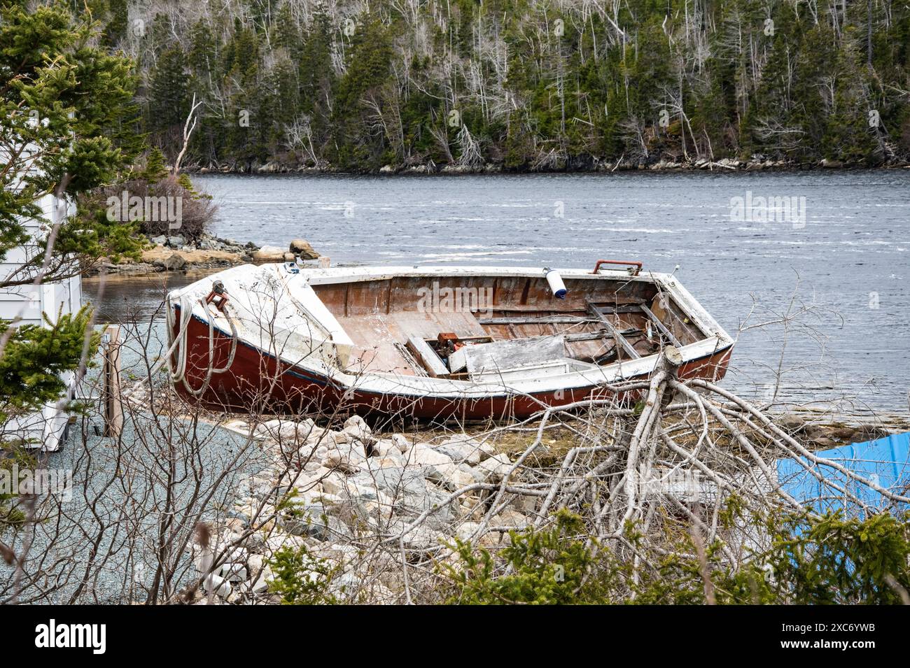 Wooden fishing boat stored on the beach in Jeddore Oyster Ponds, Nova ...