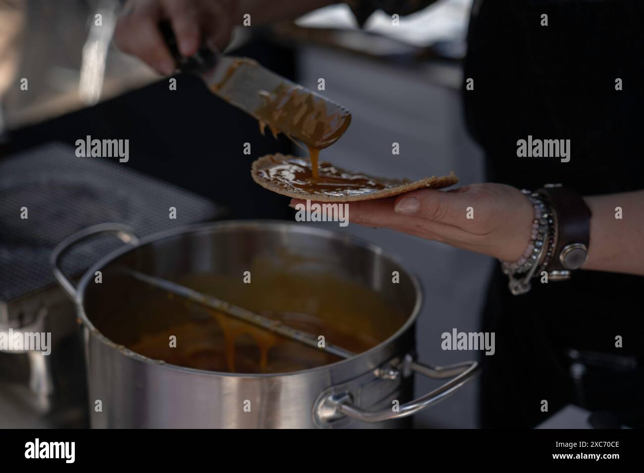 person at local markets in The Netherlands making dutch waffles ...