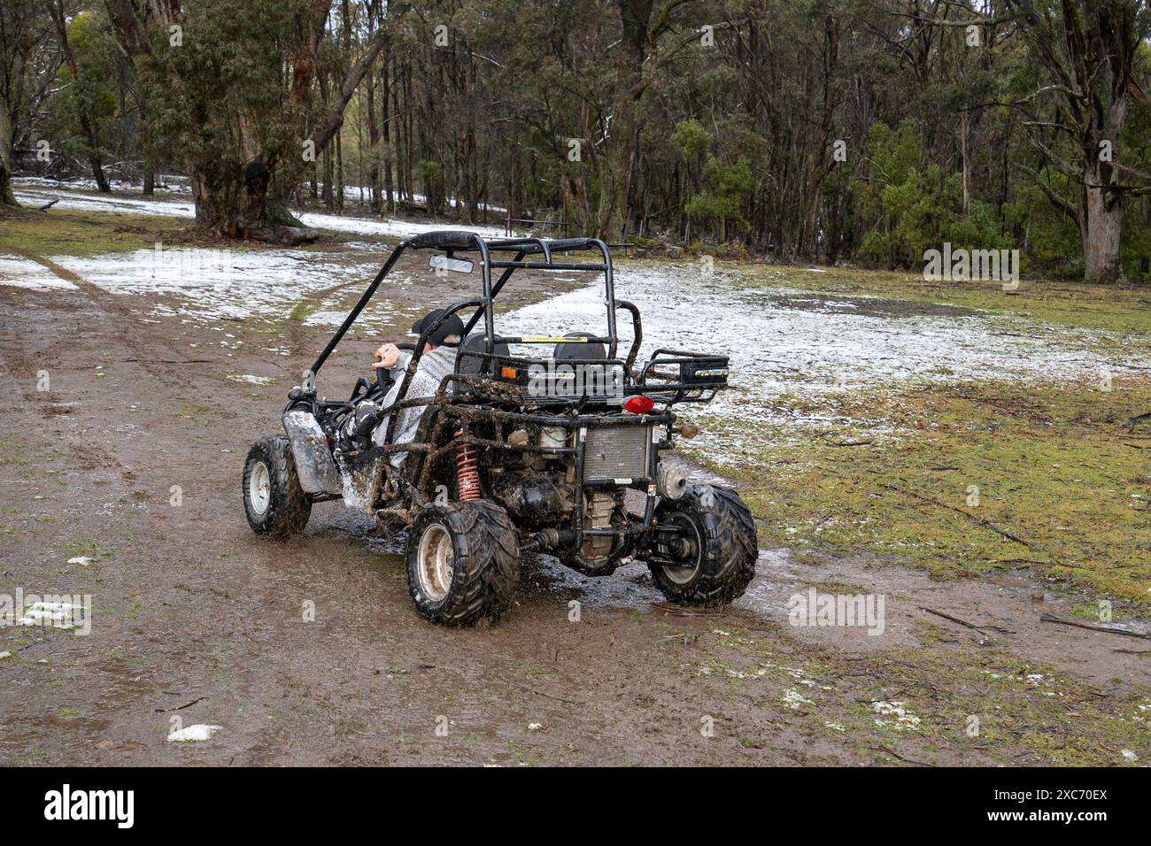 Dune buggy being driven through the snow Stock Photo - Alamy