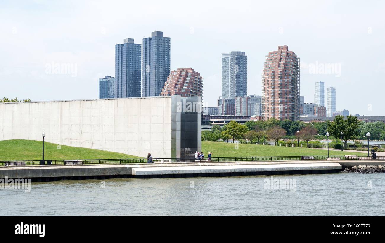 Scenic Urban Landscape with Pedestrian Walkway, Green Lawn, River, and ...