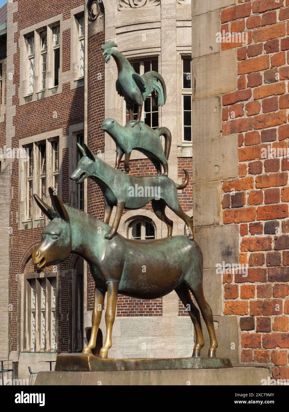 Bronze sculpture showing a donkey, dog, cat and rooster in a historic ...