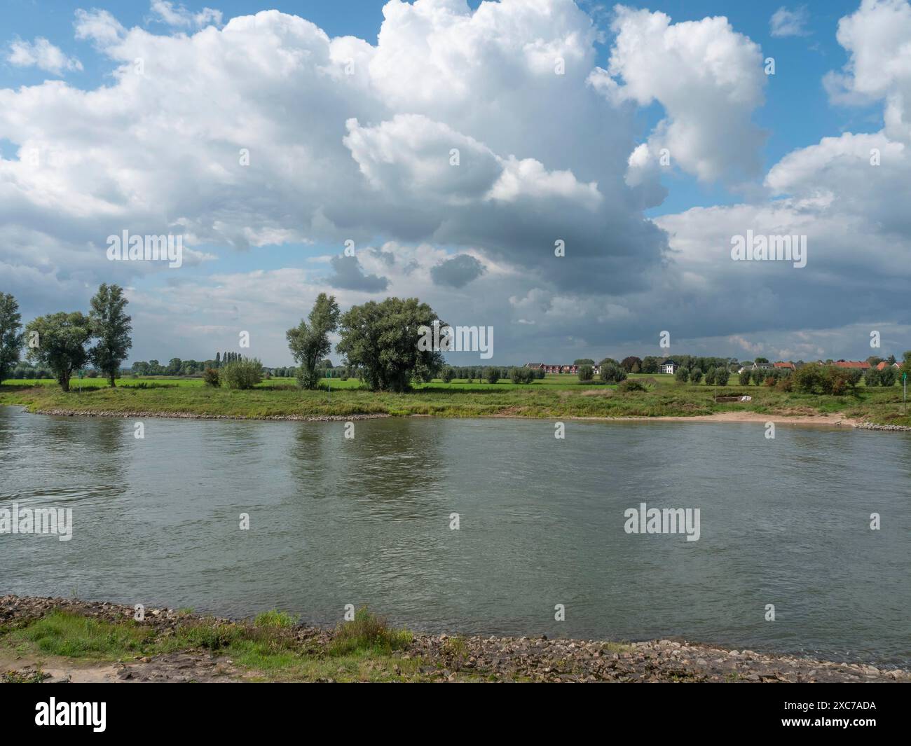 Calm river flows along green hi-res stock photography and images - Alamy