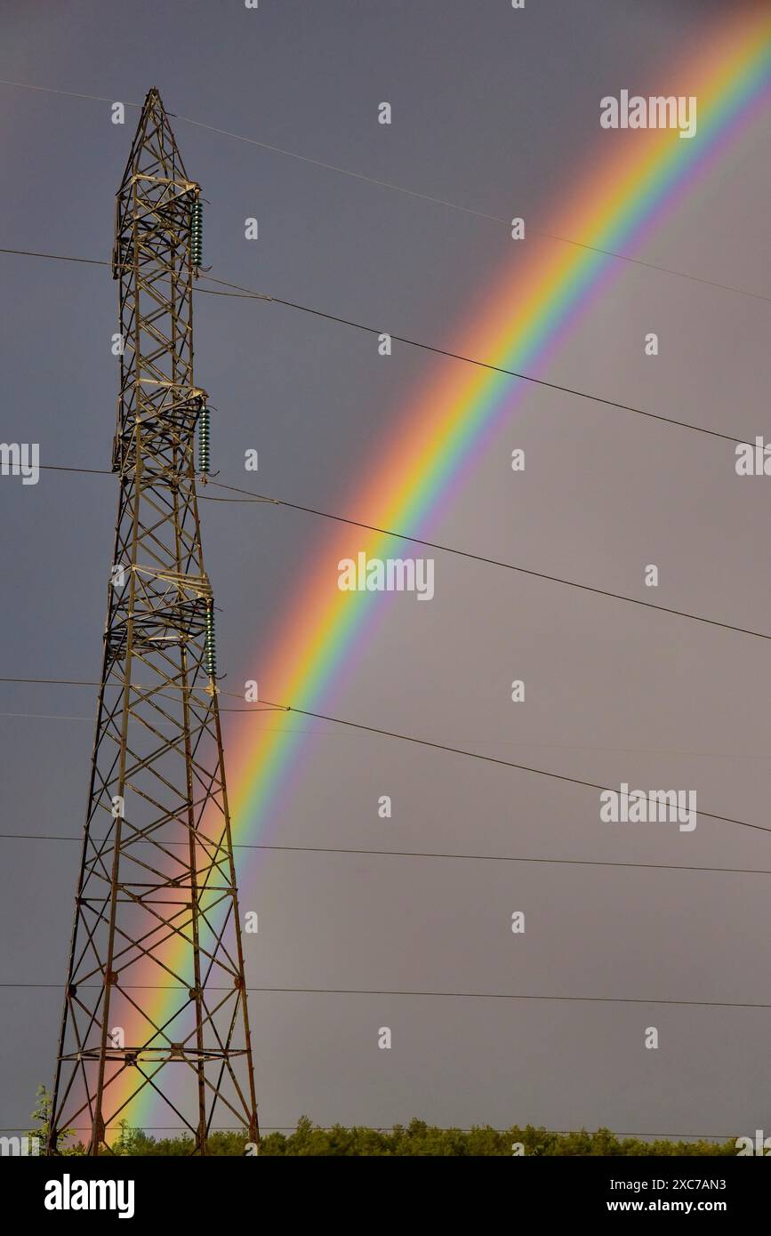 Rainbow behind power pylon hi-res stock photography and images - Alamy