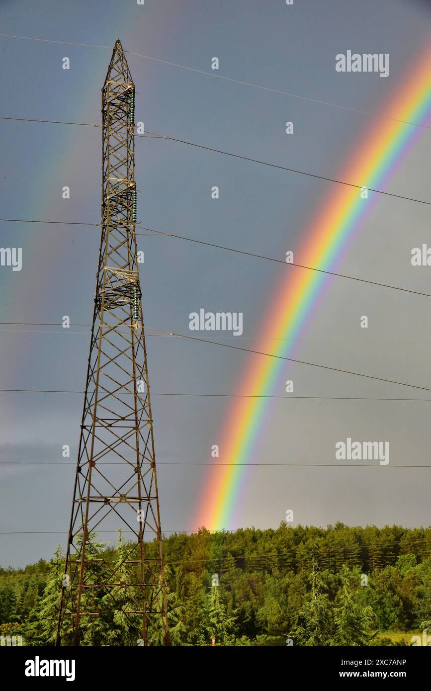 Rainbow behind power pylon hi-res stock photography and images - Alamy