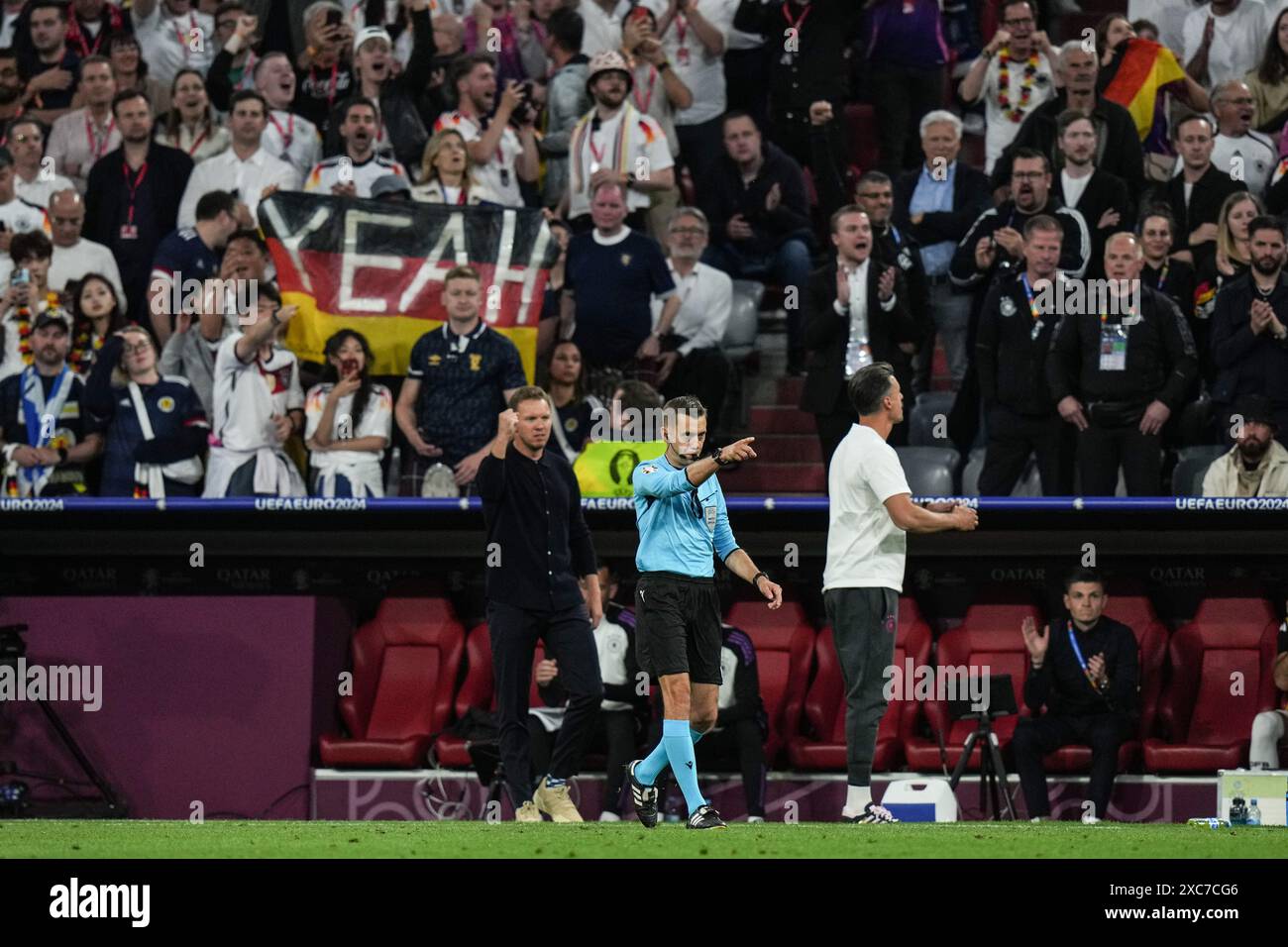 Munich, Germany. 14th June, 2024. Referee Clement Turpin (C) awards a ...