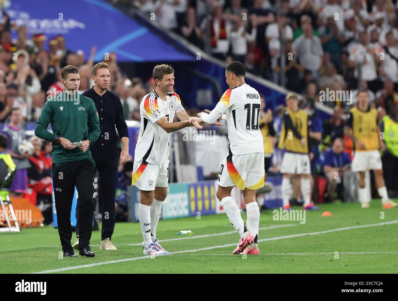 Munich, Germany. 14th June, 2024. Thomas Muller (2nd R) of Germany ...