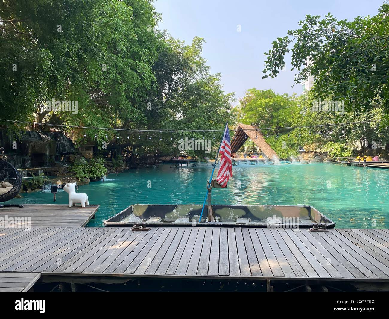 Outdoor swimming pool under shady nature Stock Photo - Alamy