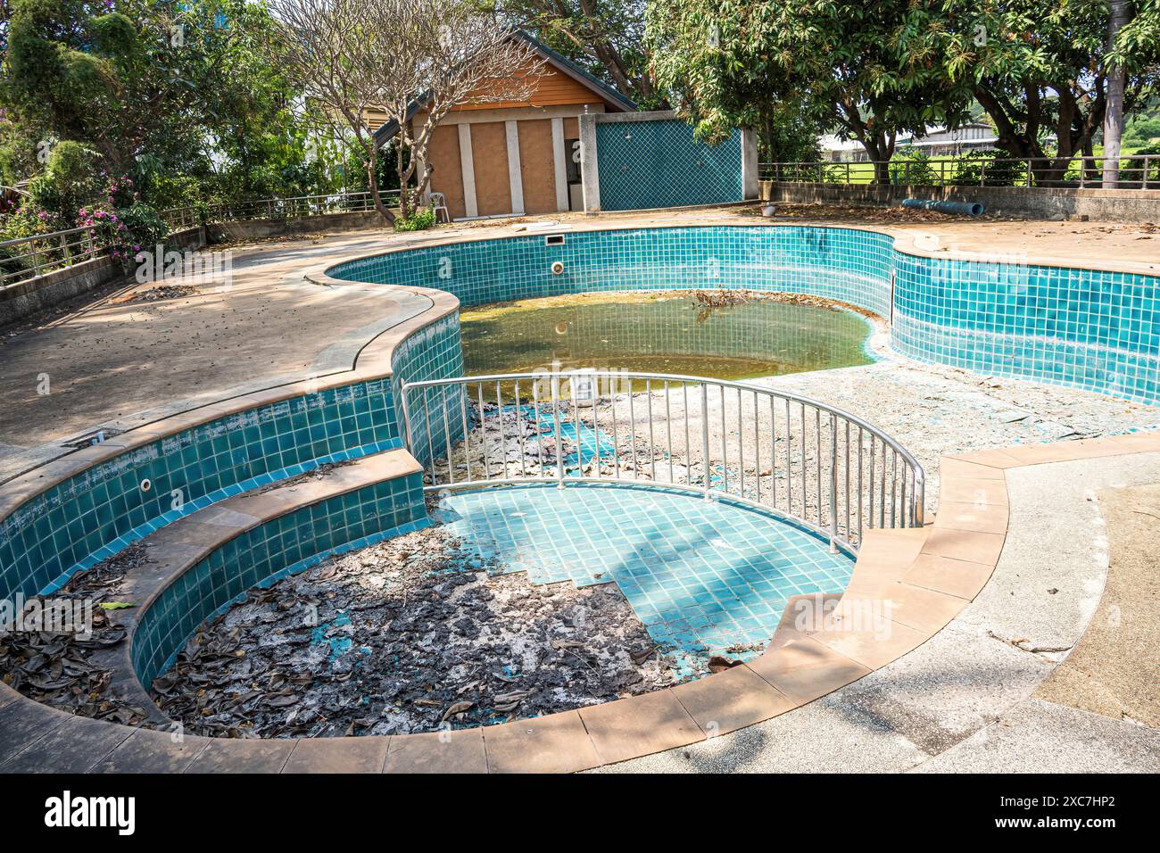 Abandoned swimming pool in the garden house Stock Photo - Alamy