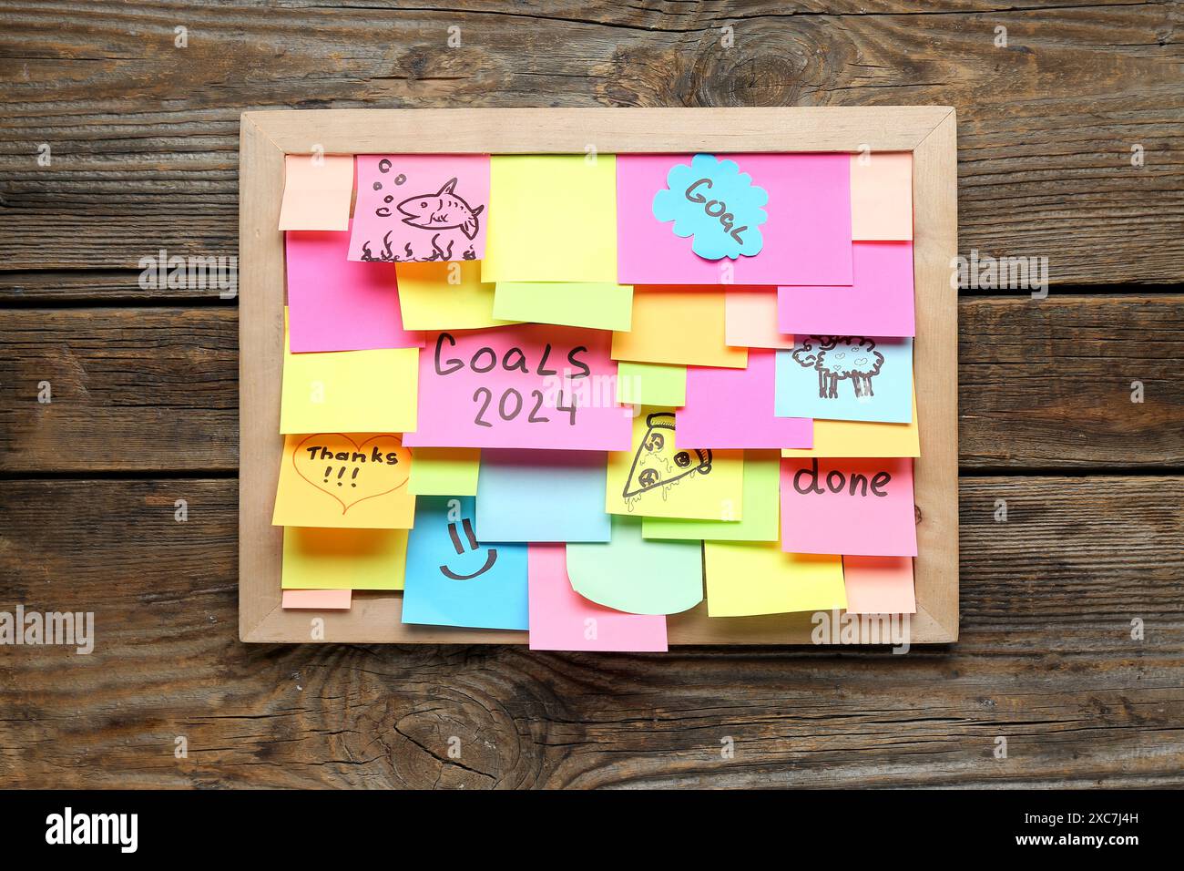 Board with sticky notes on wooden background Stock Photo - Alamy