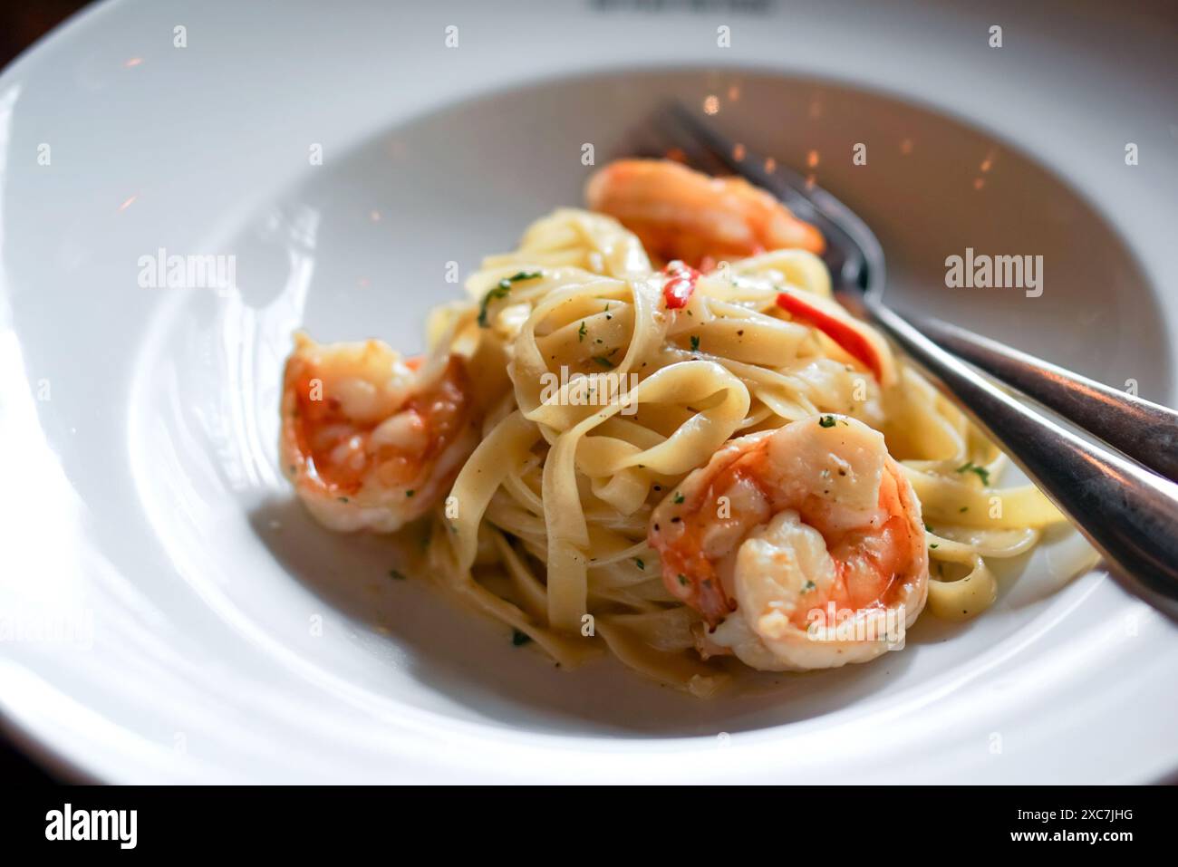 Tagliatelle spaghetti with shrimp, made simple way with garlic, chili, olive oil, parsley and ...