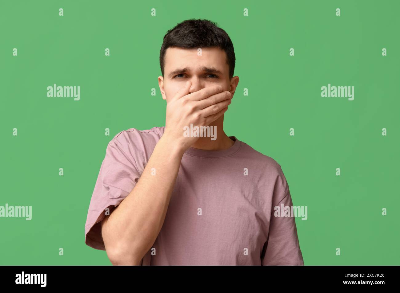 Handsome young man pinching hi-res stock photography and images - Alamy