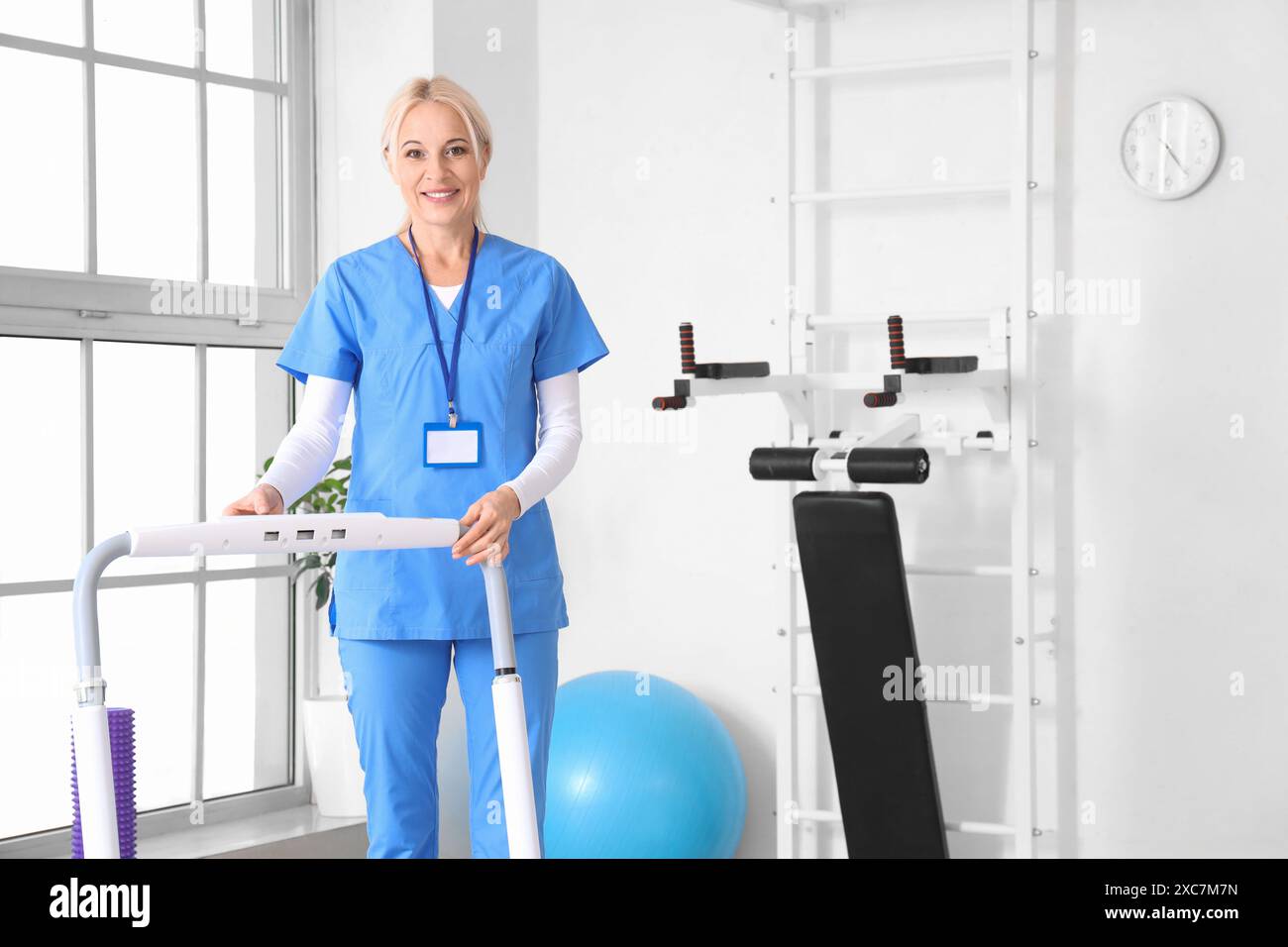 Female physiotherapist on treadmill in rehabilitation center Stock ...