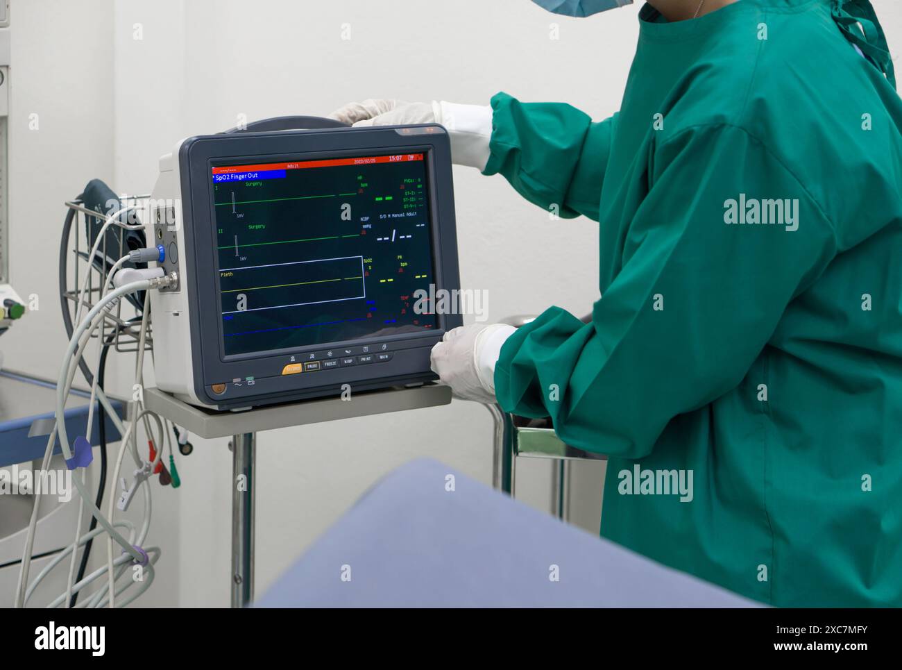 A dedicated healthcare professional in a sterile surgical gown ...