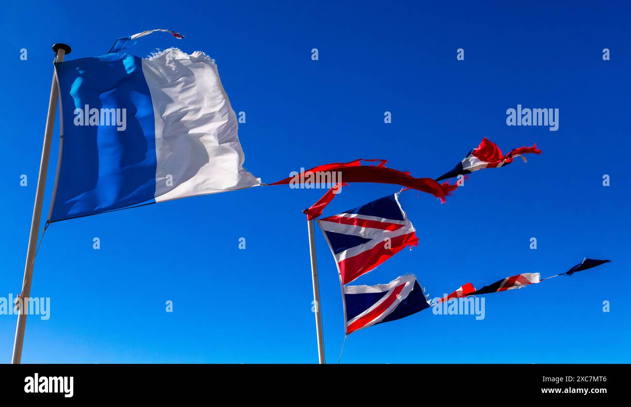 Torn French and British flags in the wind Stock Photo - Alamy
