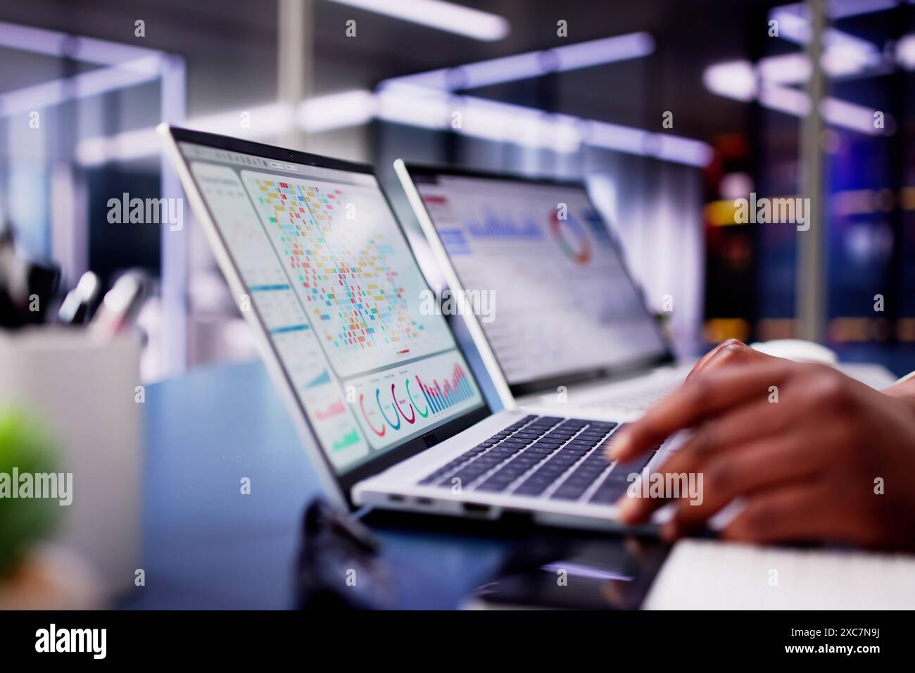 African American woman using virtual dashboard to predict emerging ...