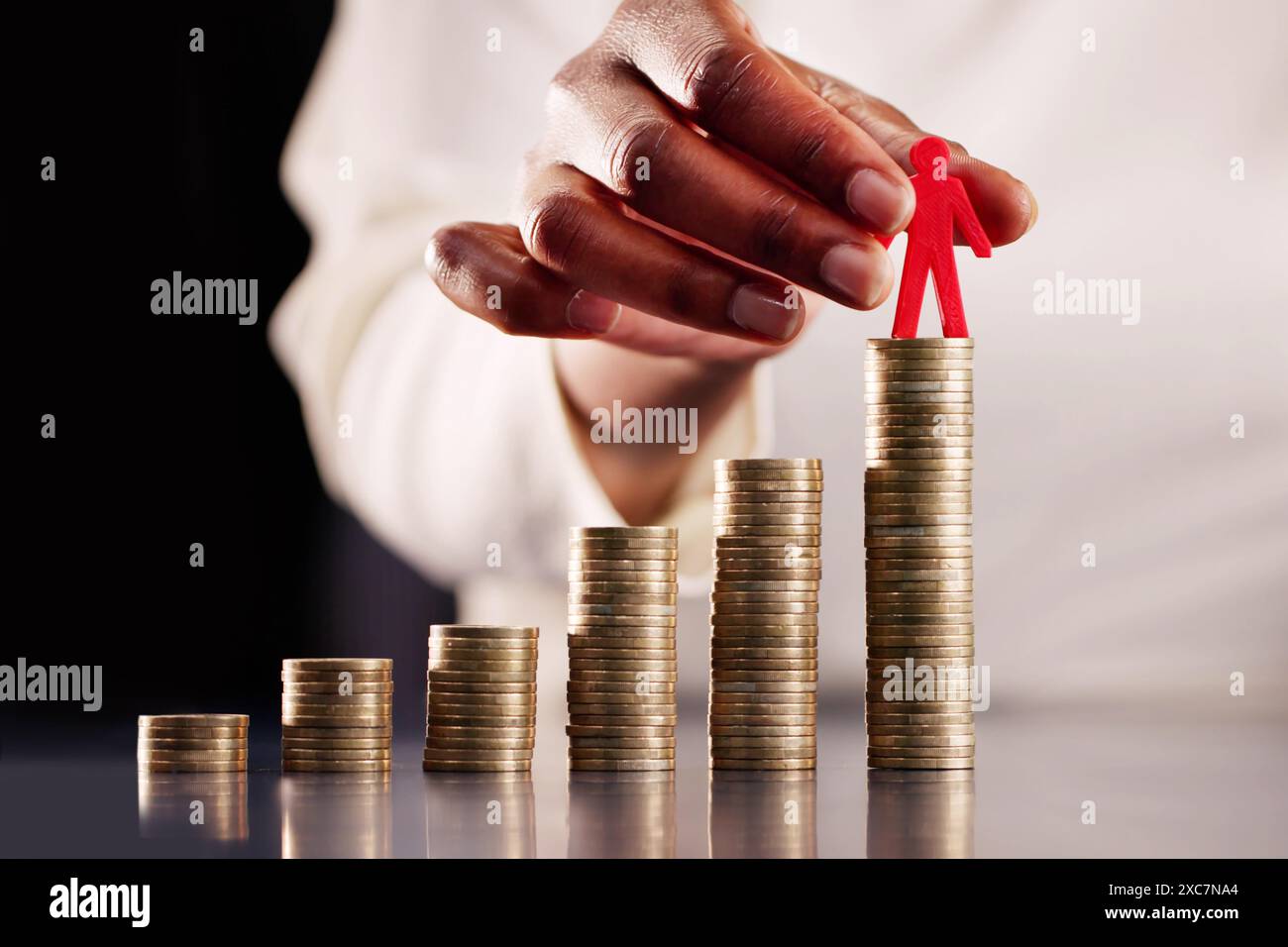 African American woman analyzes financial charts for salary growth as a ...