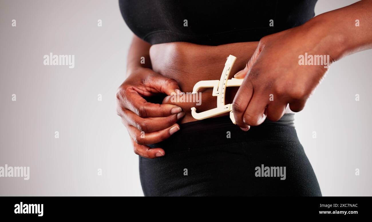 Black woman measuring body hi-res stock photography and images - Alamy
