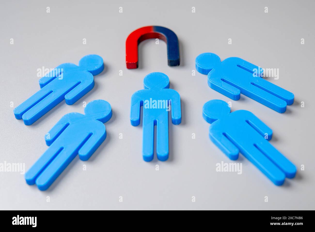 Magnet attracts human figure. Customer acquisition and customer ...