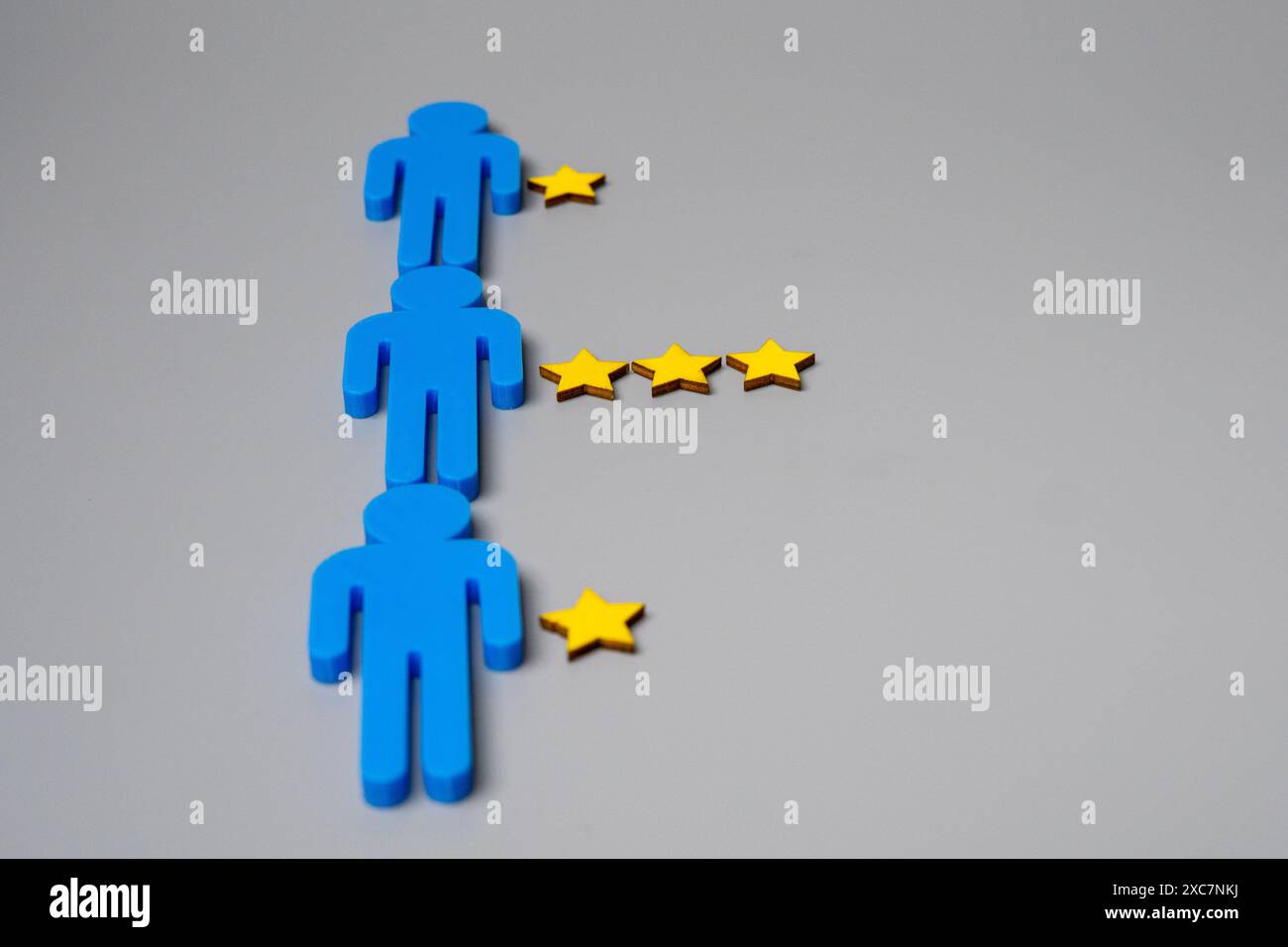 Human figure and yellow stars with copy space. Performance appraisal ...