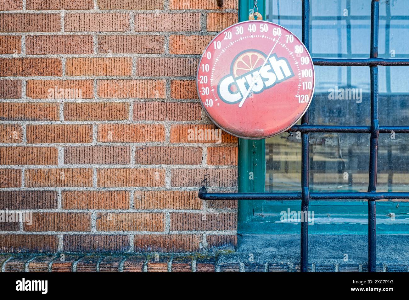 A vintage Orange Crush thermometer shows the temperature hanging on the ...