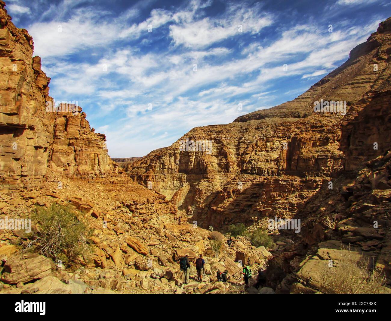 Hikers in the Barren rugged Namibian Mountains while descending into ...