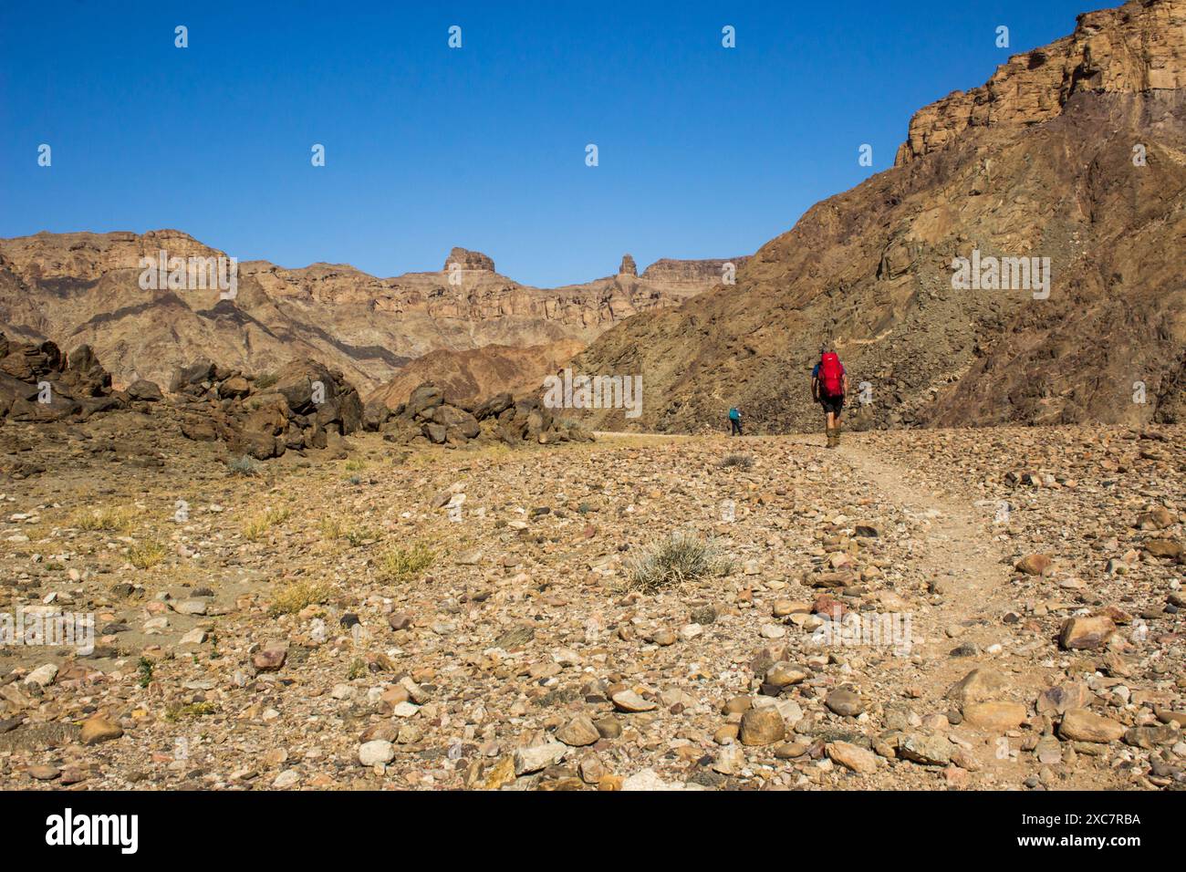 A narrow trail through the barren rock strewn landscape of the Fish ...