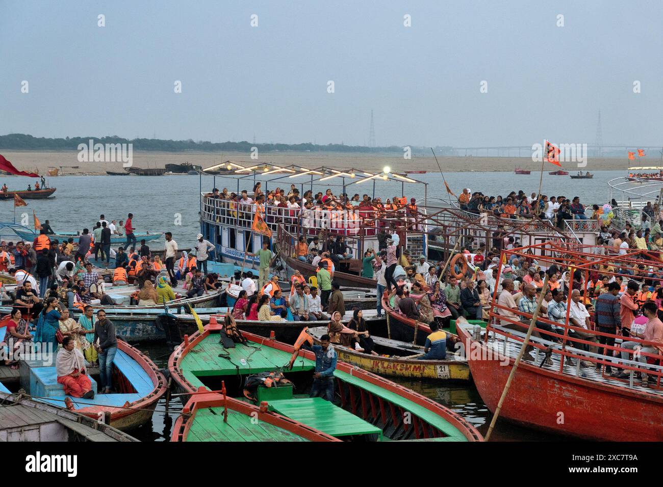 Varanasi, India: pilgrim boats on the river. Varanasi is one of the ...
