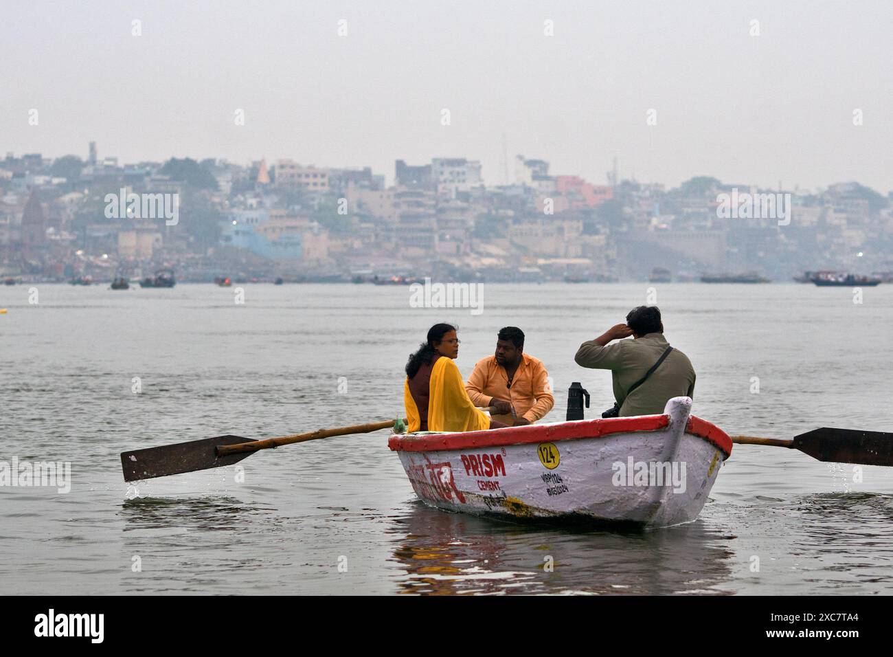 Varanasi, India: pilgrim boats on the river. Varanasi is one of the ...