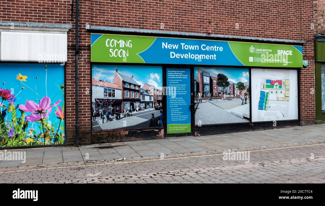 Shop front advertising new town centre development in Darlibgton ...