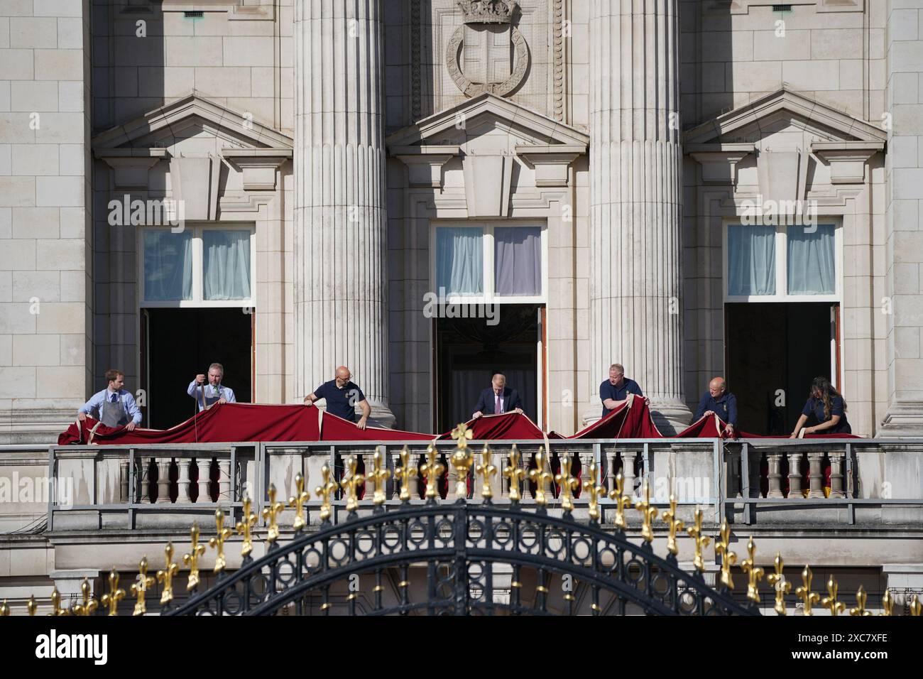 Royal household staff prepare the balcony at Buckingham Palace, London ...
