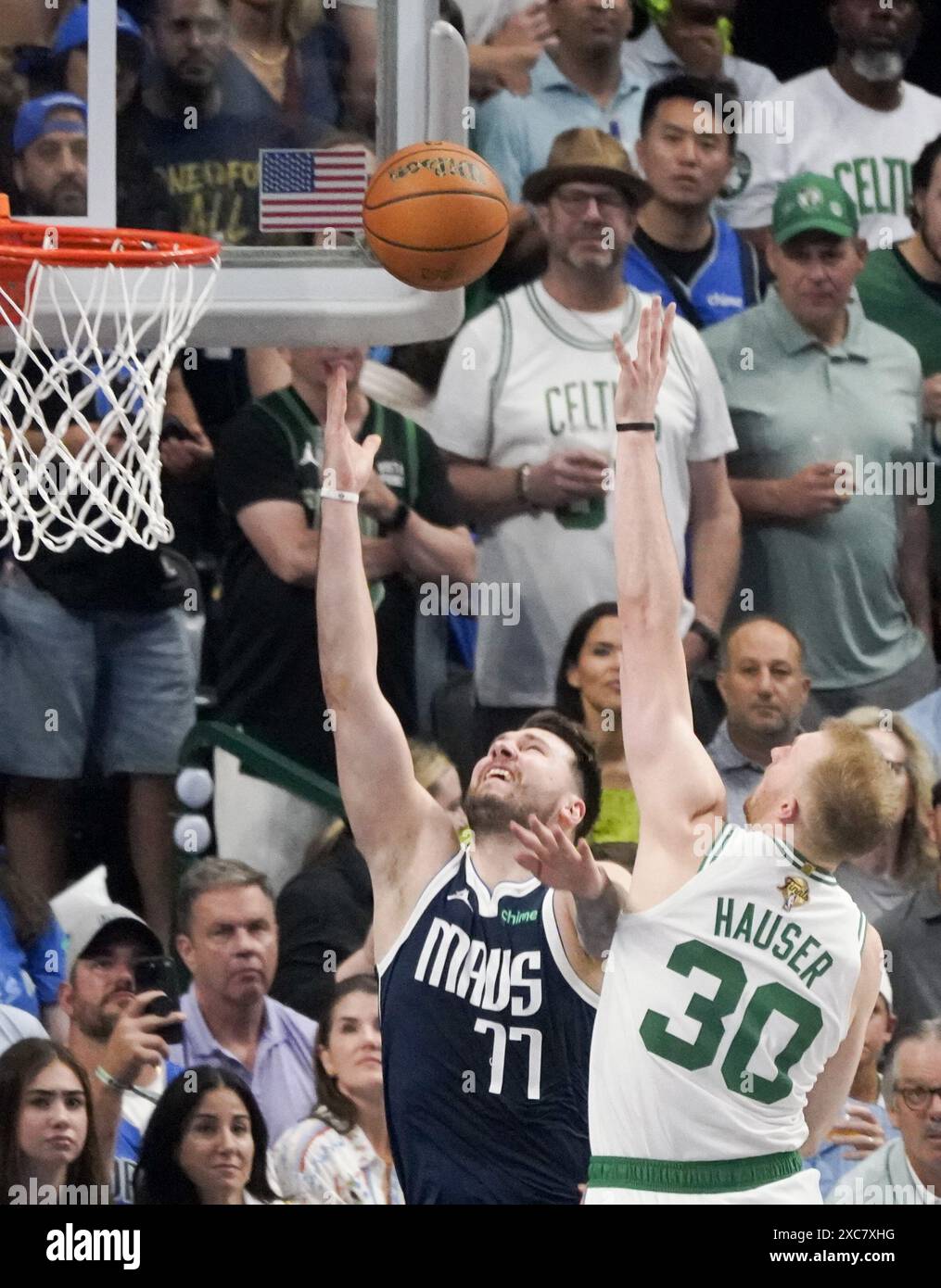 Dallas, USA. 14th June, 2024. Dallas Mavericks' Luka Doncic (L) goes ...