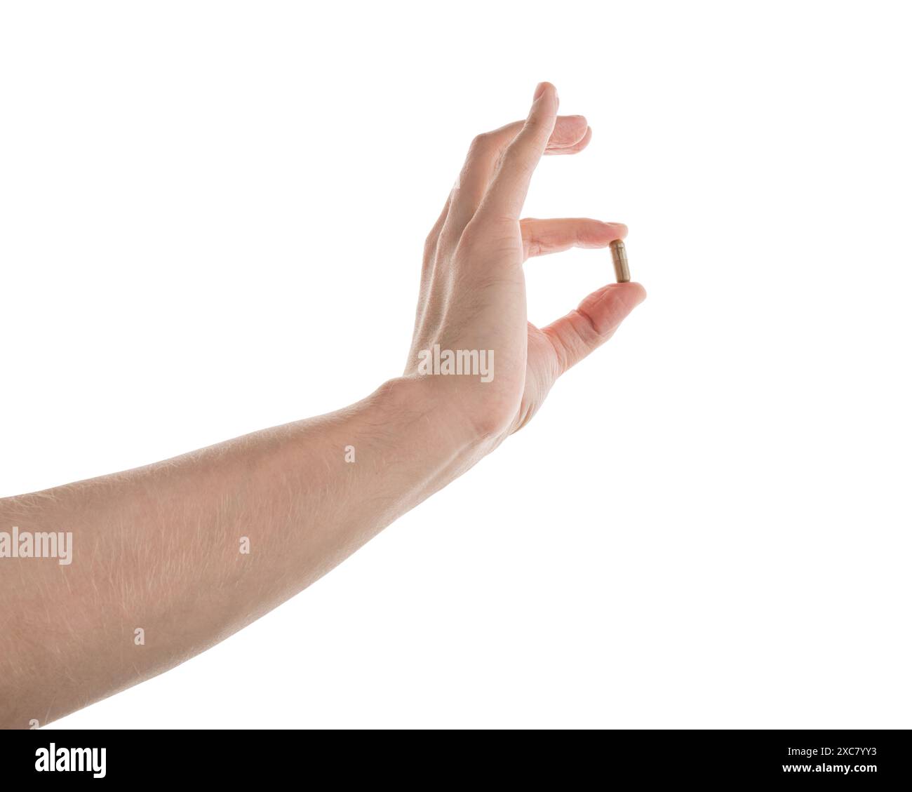 Male hand show brown pill isolated on white background Stock Photo - Alamy