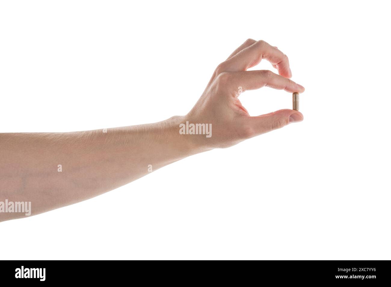 Male hand show brown pill isolated on white background Stock Photo - Alamy