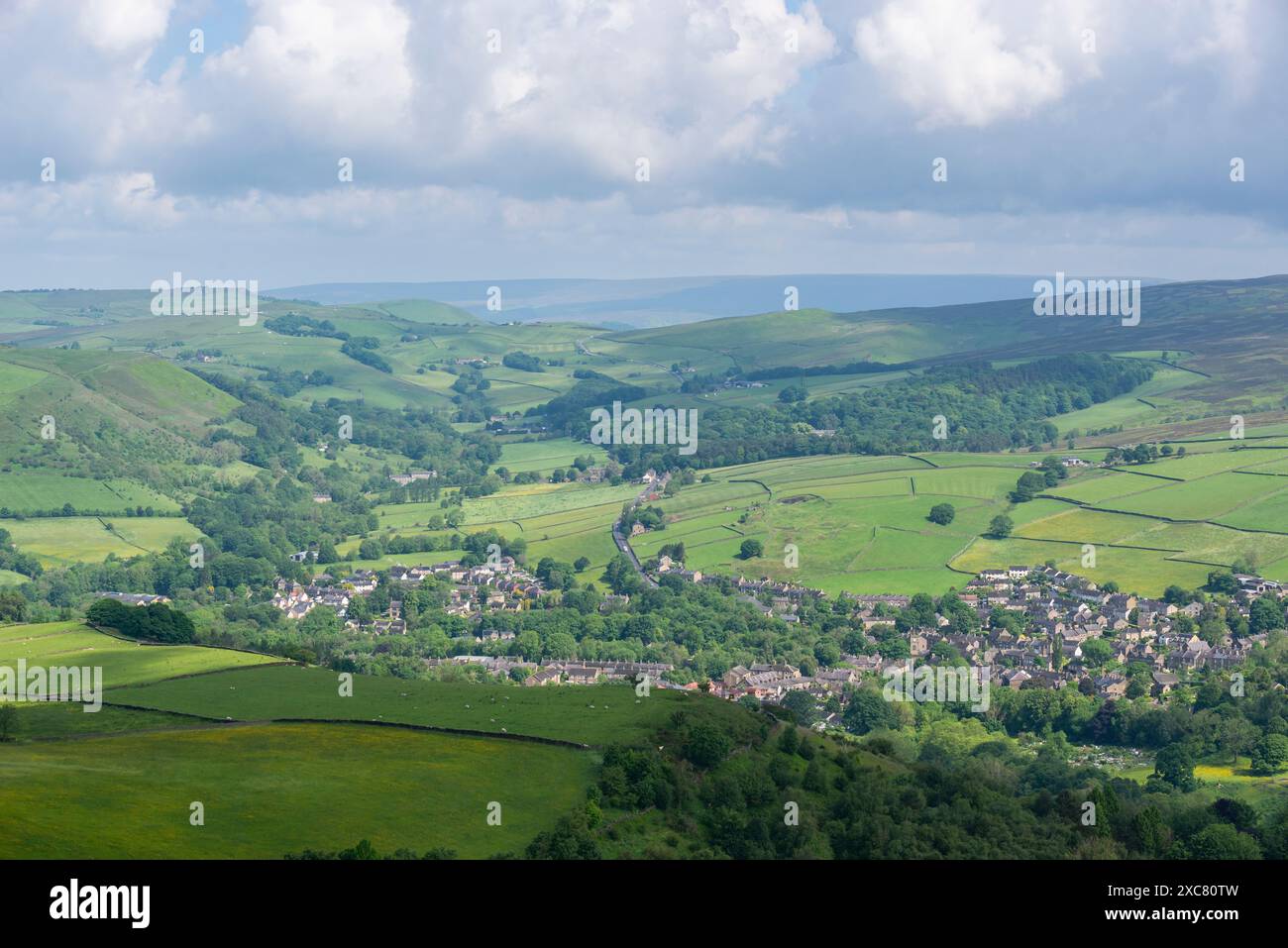 The village of Hayfield surrounded by hills in the Peak District ...