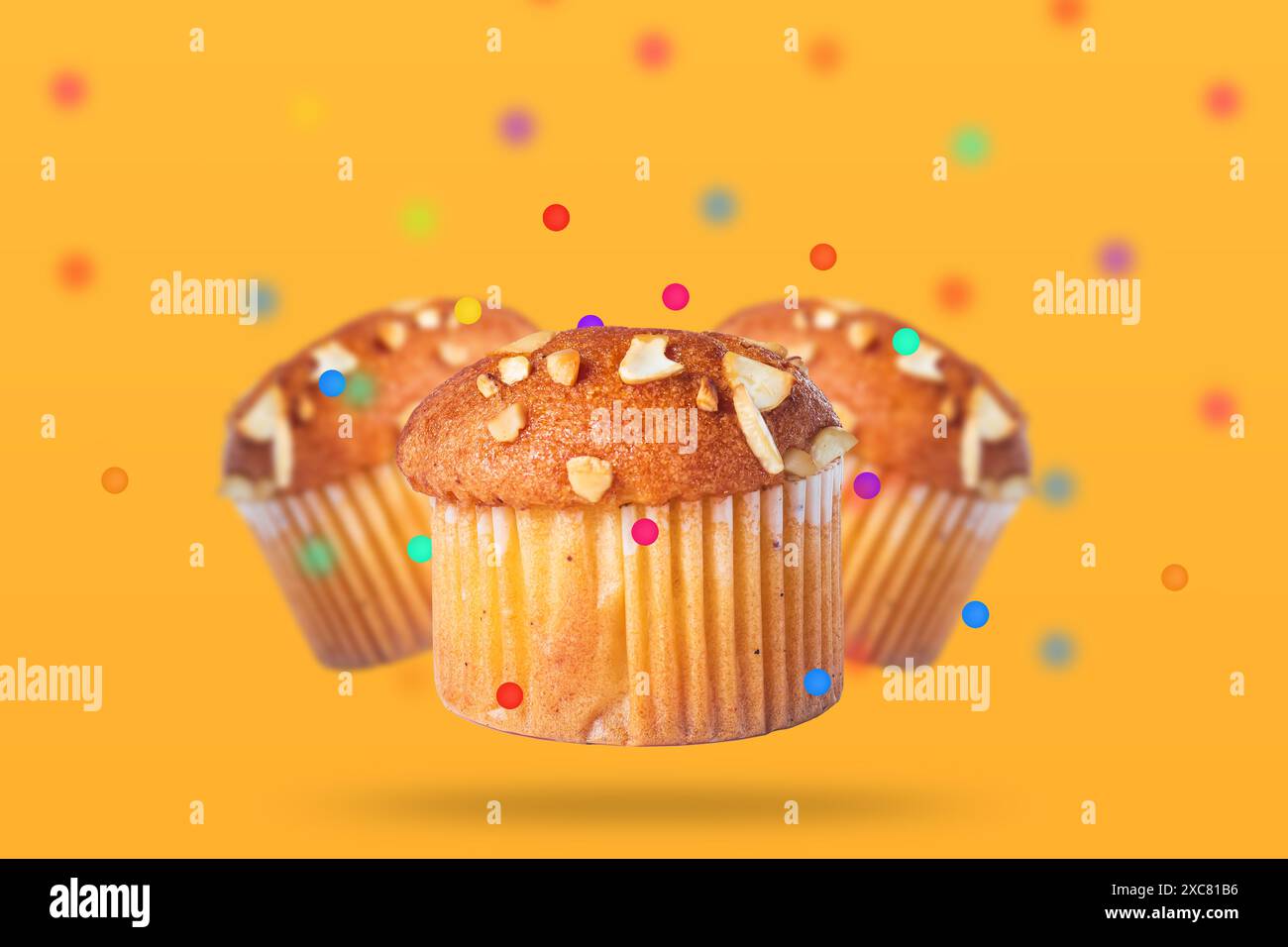 Three delicious almond topped muffins with colorful confetti float on a ...