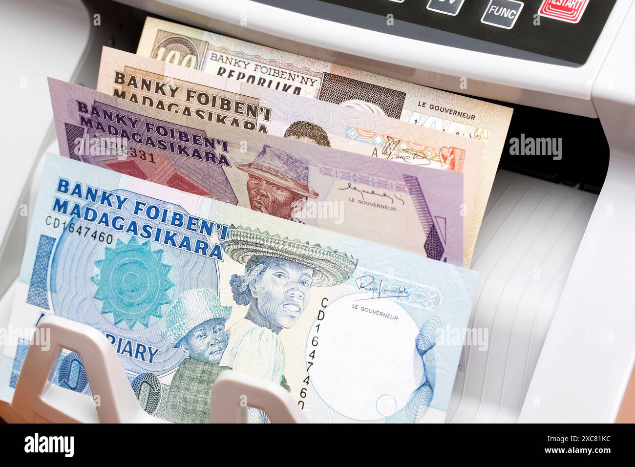 Old Malagasy money - ariary in the counting machine Stock Photo - Alamy