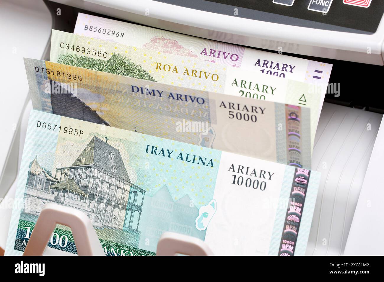 Malagasy money - ariary in the counting machine Stock Photo - Alamy