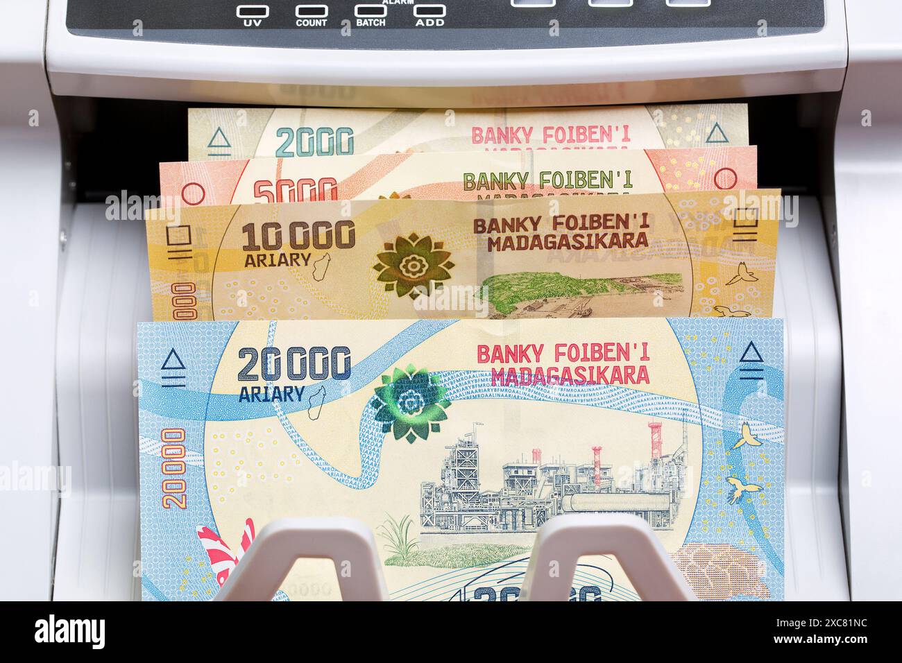 Malagasy money - ariary in the counting machine Stock Photo - Alamy