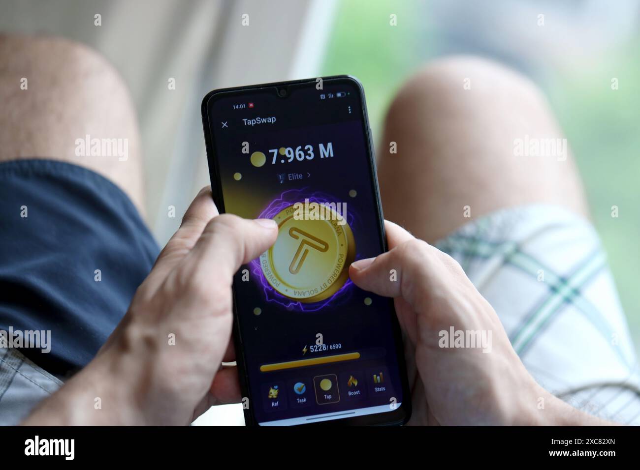 KYIV, UKRAINE - APRIL 20, 2024 Tap Swap telegram bot on smartphone screen. Tap Swap is a viral ...