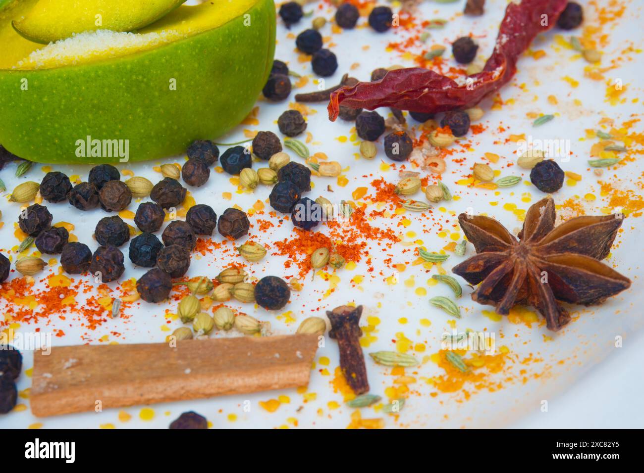 left side view of sprinkled Indian spices commonly used in mango pickle ...