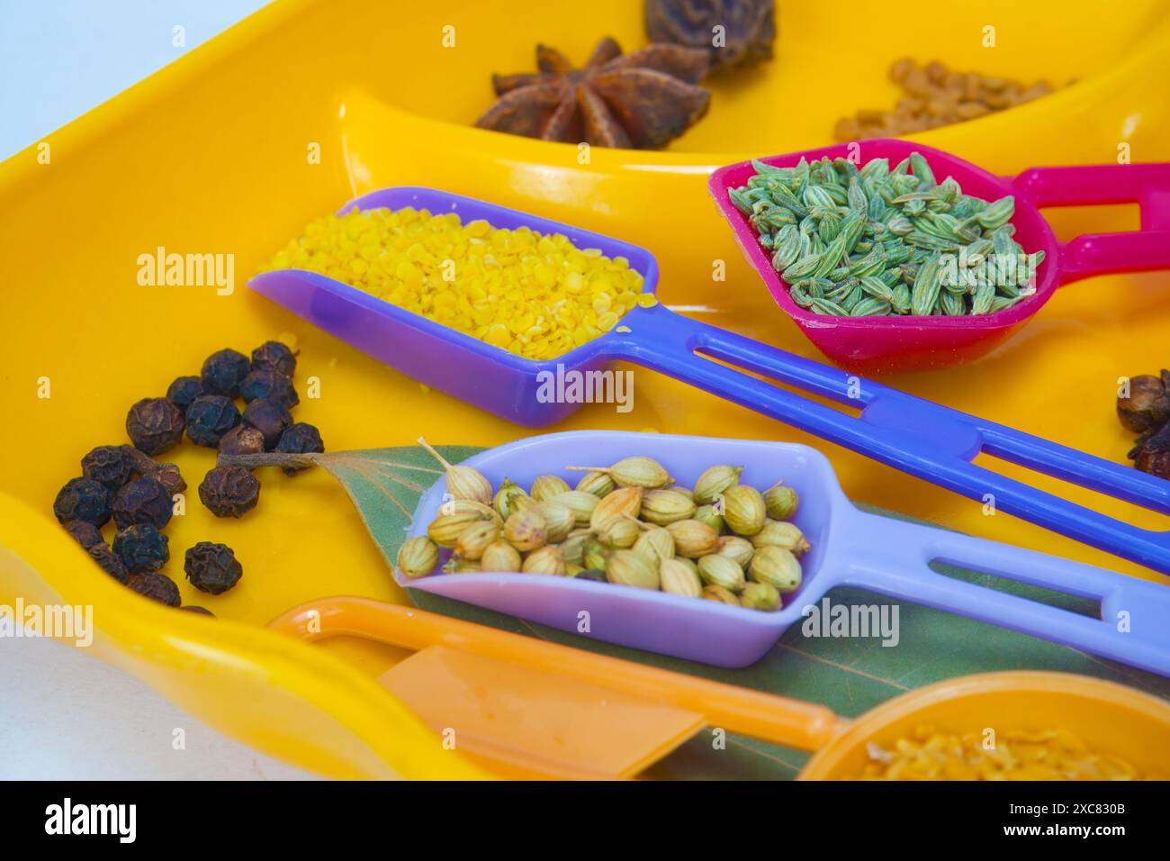 corner view of Mixed indian spices for mango pickle like, red chilli ...