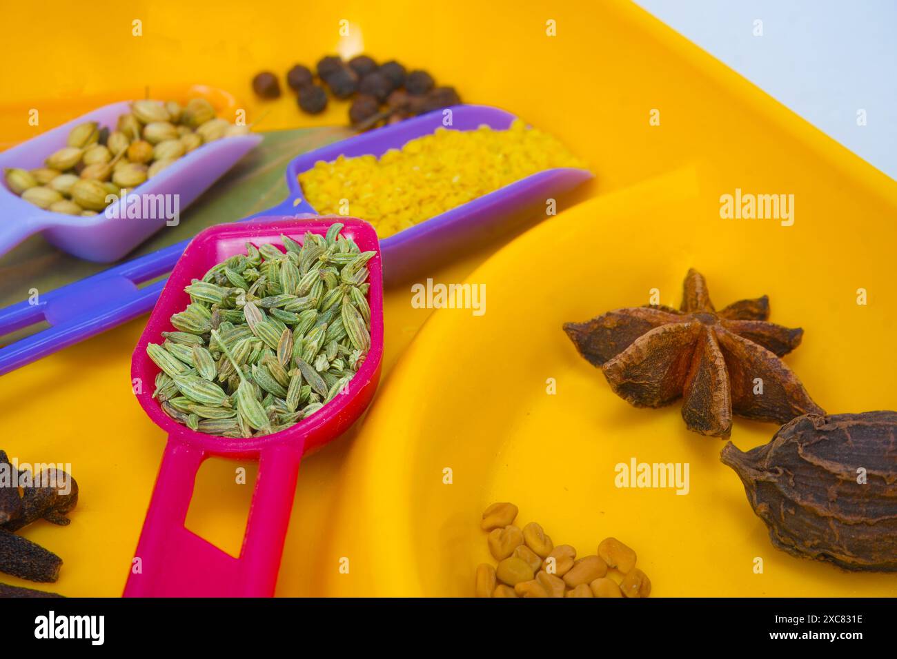 corner view of Mixed indian spices for mango pickle like, red chilli ...