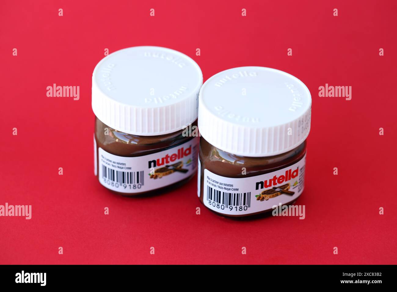 KYIV, UKRAINE - APRIL 20, 2024 Mini Nutella 25g jar on a red background ...