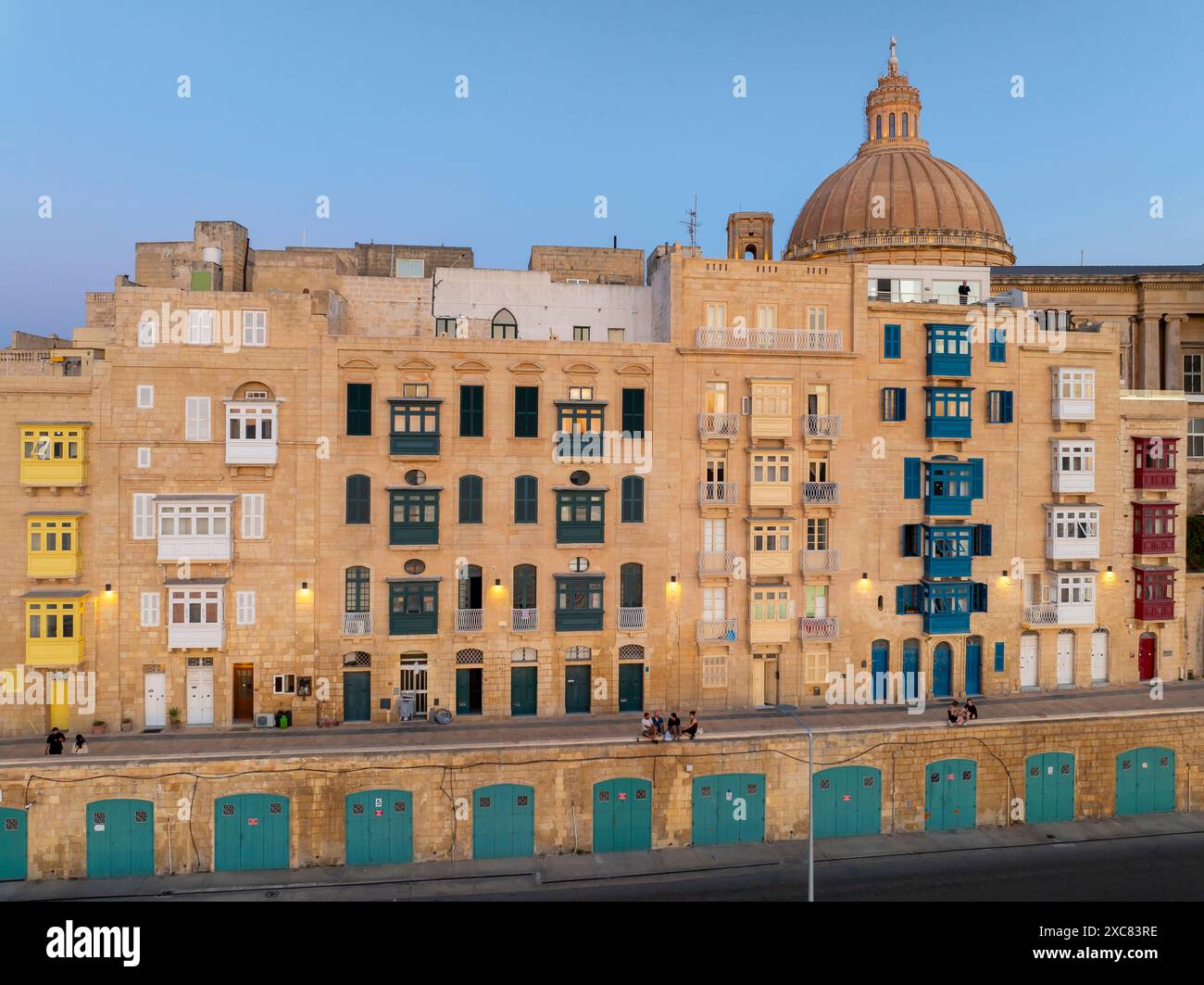 iconic yellow house wall with colorful balcons and windows. Tipical ...