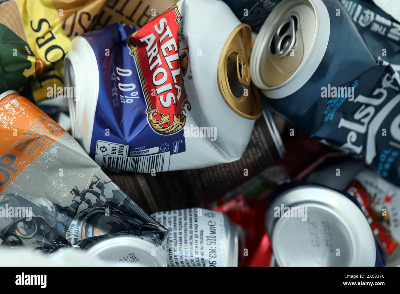 KYIV, UKRAINE - APRIL 20, 2024 Background of various crashed beer cans ...